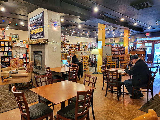 Warm wooden tables and gentle lighting create the perfect ecosystem for books to be discovered and enjoyed.