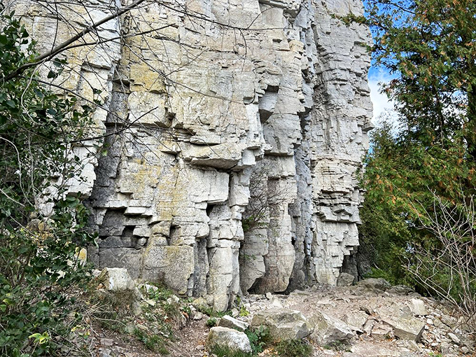 Limestone cliffs stand like ancient sculptures, their weathered faces telling geological stories spanning millions of years.