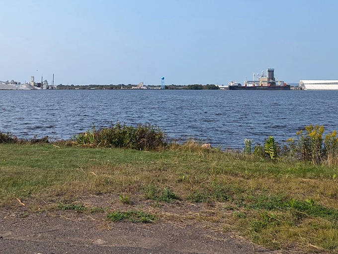 The industrial silhouette of Duluth's harbor provides a fascinating contrast to the natural beauty of Park Point's shoreline.