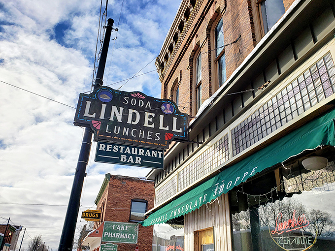 The vintage neon sign beckons hungry travelers and locals alike, promising soda fountain delights that Instagram filters can't improve upon.