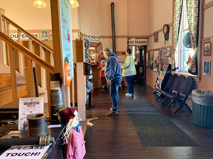Visitors gather in the station, their expressions mirroring those of travelers a century ago &ndash; anticipation never goes out of style.