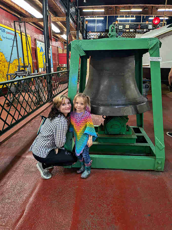 Visitors of all ages connect with Great Lakes maritime history at the Valley Camp. The ship's bell, once used to mark watches, now stands silent but imposing.