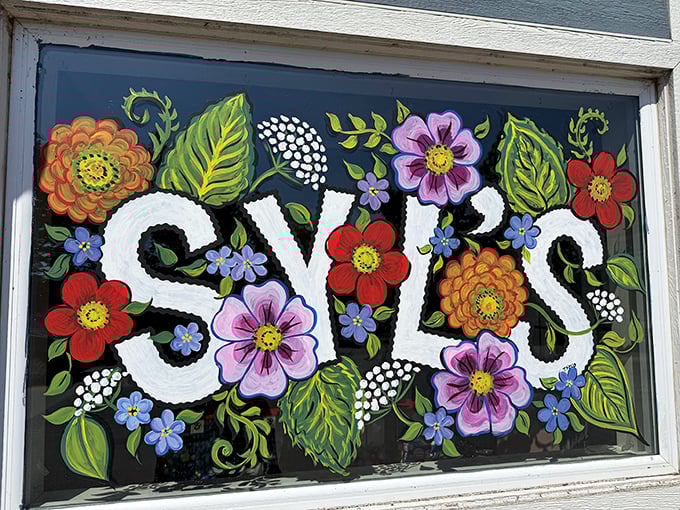 Hand-painted flowers frame the Syl's name &ndash; artistic touches that show this isn't just a business, it's a labor of love.