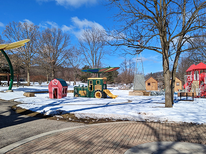 Winter transforms the playground into a snow-dusted wonderland where cold noses and warm hearts are the season's best accessories.