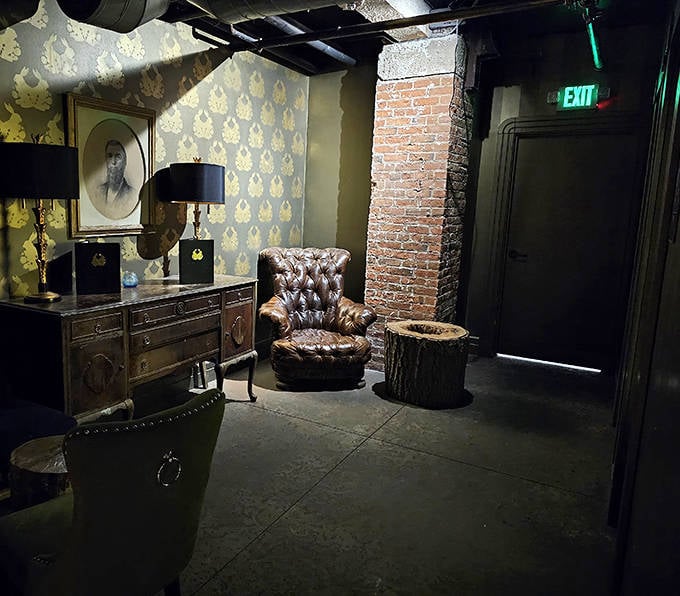 Lounge: A leather wingback chair awaits beside period-appropriate décor, creating a corner that feels plucked from a 1920s gentleman's club.