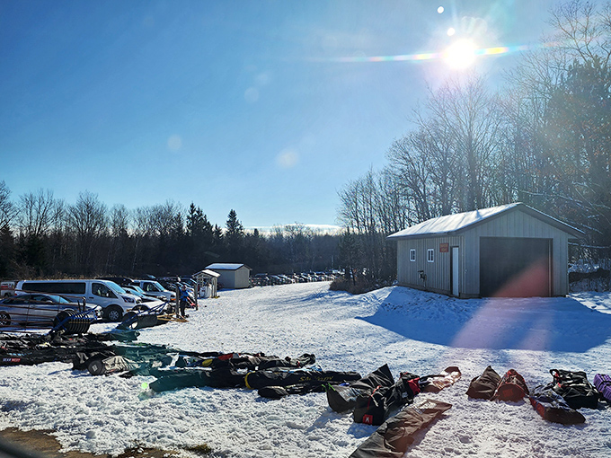 ABR's pristine trails await winter adventurers, with equipment lined up ready for another day of cross-country exploration.