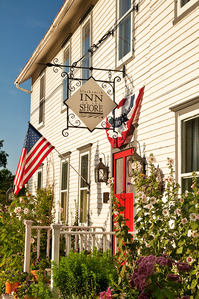 The Blacksmith Inn On the Shore combines historic charm with flower-draped porches &ndash; where yesterday's craftsmanship meets today's comfort.