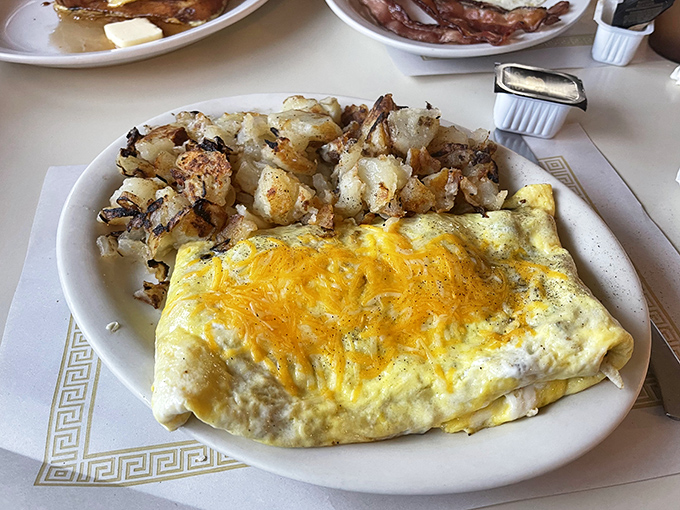 This hearty breakfast features a fluffy omelet with hash browns that could fuel a lumberjack, or at least get you through a Michigan winter morning.