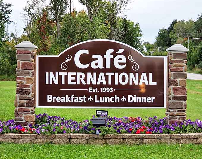 The welcoming sign stands like a culinary lighthouse, guiding hungry travelers to this unexpected global feast established in 1993.