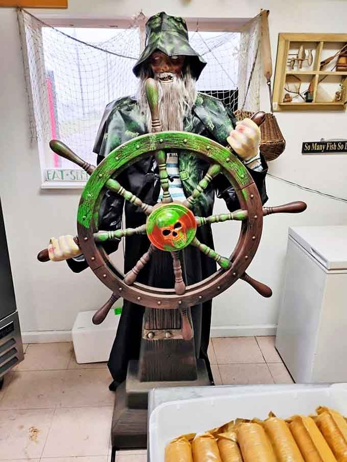 The silent guardian of Peterson's Fish Market stands watch, reminding visitors of the deep maritime traditions behind every delicious bite served here.