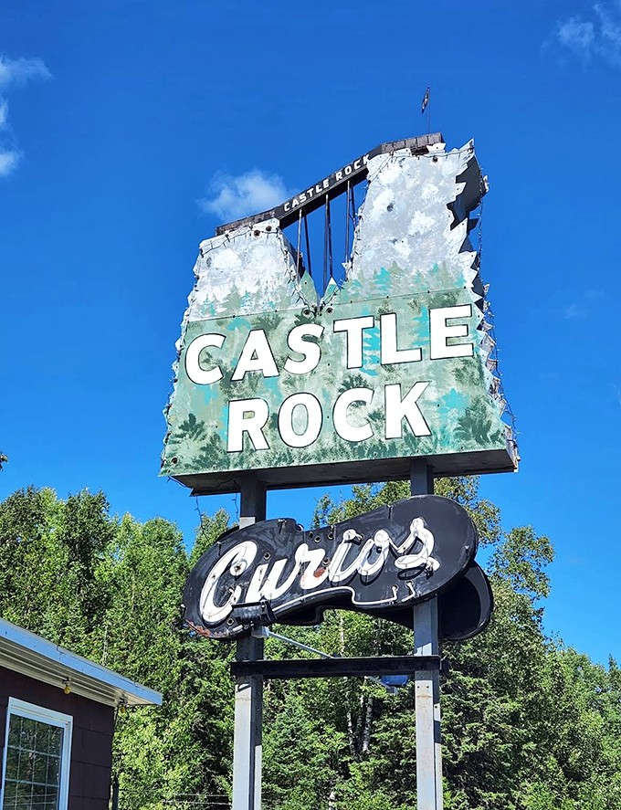 That vintage signage practically screams classic road trip, the kind of retro charm that Instagram filters try desperately to replicate.