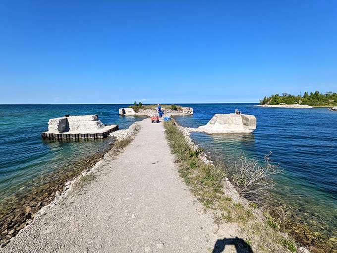 This man-made pier stretches into Lake Huron like a concrete runway, offering panoramic views of the stunning shoreline.