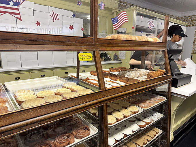 The counter experience combines small-town charm with big-city efficiency as staff navigate the daily rush of sugar-seeking customers.