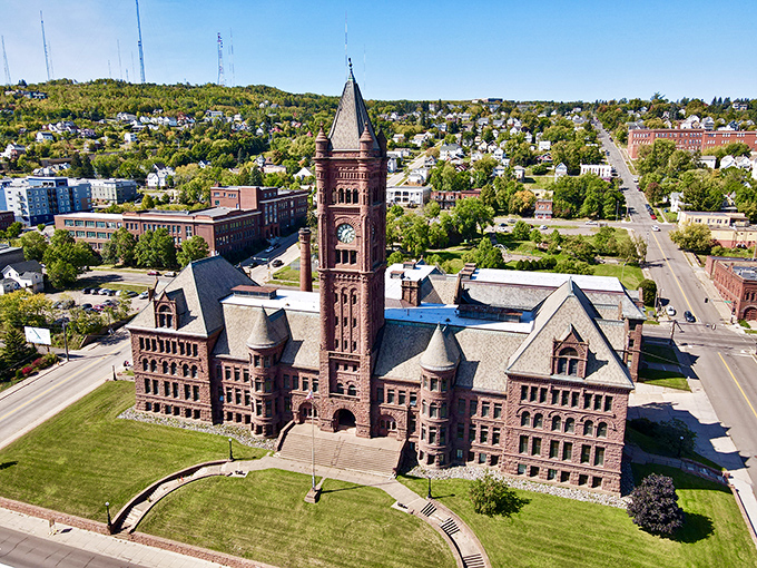 Duluth's historic courthouse commands the hillside with Romanesque authority, its brownstone towers watching over the city like a benevolent medieval castle.