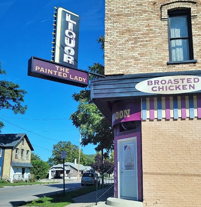 The vertical "LIQUOR" sign stands tall above The Painted Lady Saloon entrance, a beacon of hospitality that's guided thirsty travelers for generations.