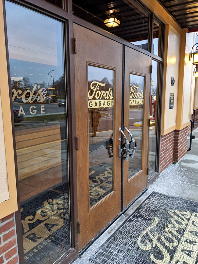 The entrance doors, designed to resemble vintage wooden garage doors, serve as the first hint that this isn't just dinner, it's a full immersion into automotive history.