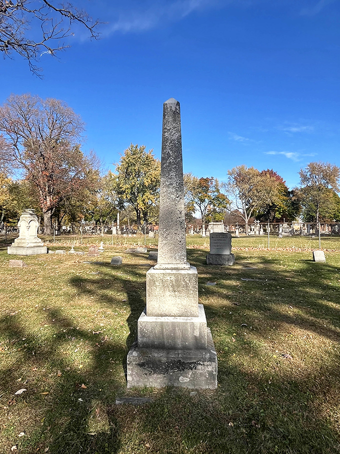 This slender monument reaches skyward like the ambitions of Detroit's early citizens, silhouetted against the cemetery's open landscape.