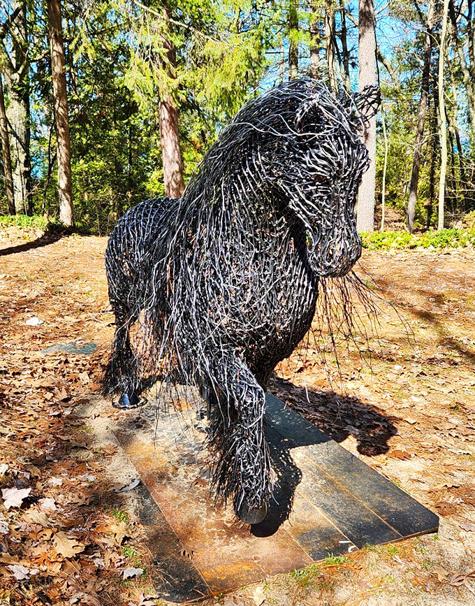 "Gypsy" gallops through the clearing, hundreds of metal strands woven into a horse that seems frozen mid-motion yet somehow alive.