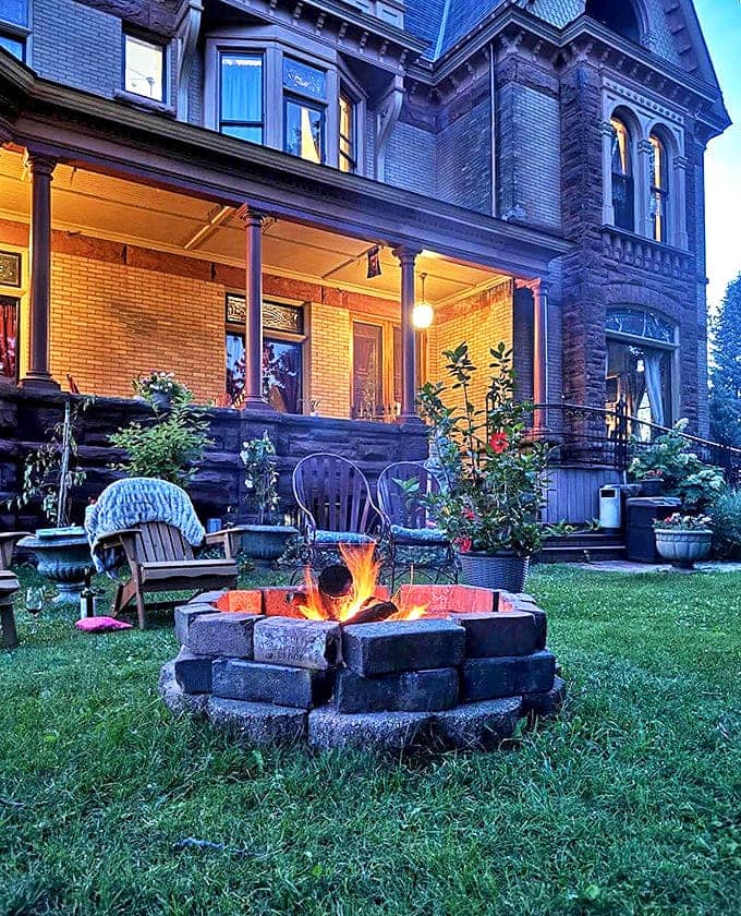 Outdoor Fire Pit: As twilight descends, flames dance hypnotically in the stone-lined fire pit, creating the perfect ambiance for sharing ghost stories beneath the stars.