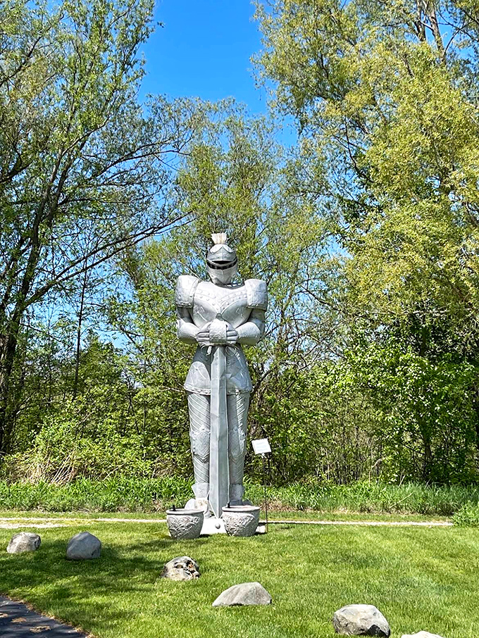 A stoic knight stands eternal guard, silently judging modern visitors who complain about walking too much while wearing comfortable sneakers.