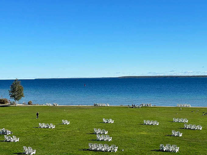 The Great Lawn stretches toward the lake with rows of white chairs, ready to host everything from weddings to the world's most scenic yoga class.