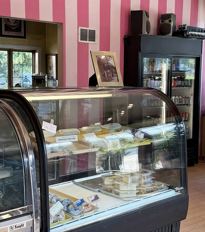 Each pastry sits like treasure behind glass – tempting, taunting, and ultimately irresistible to even the strongest-willed visitor.