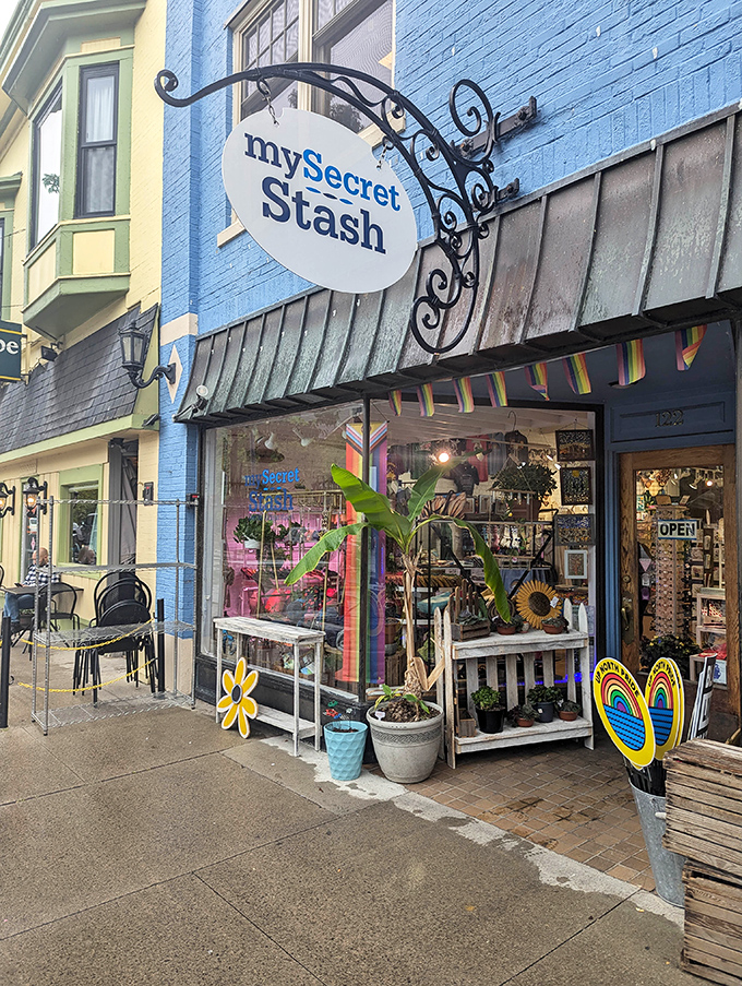 My Secret Stash's vibrant blue storefront and whimsical sign lure shoppers into a wonderland of local treasures and Michigan-made keepsakes.