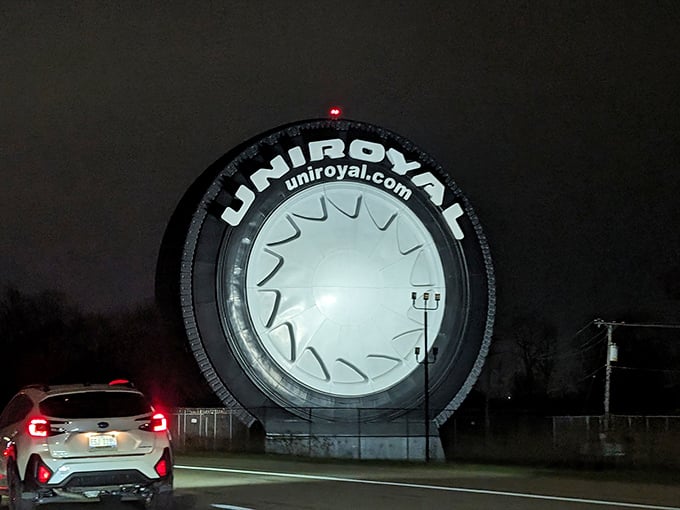 After sunset, strategic lighting transforms the Uniroyal Giant Tire into a glowing beacon for nighttime travelers.