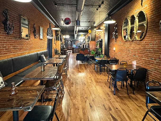 Vintage mirrors reflect the gentle bustle of the caf&eacute;, where comfortable seating invites guests to linger longer than planned.