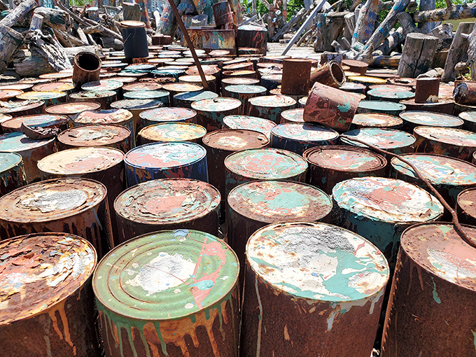 What might look like abandoned oil drums to some eyes becomes a powerful artistic statement when arranged in this intentional pattern of rust and decay.