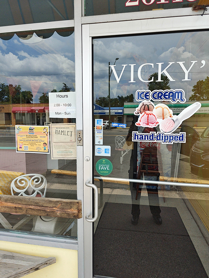 Vicky's welcoming entrance promises hours of sweet satisfaction, with a simple sign announcing when ice cream dreams can come true.