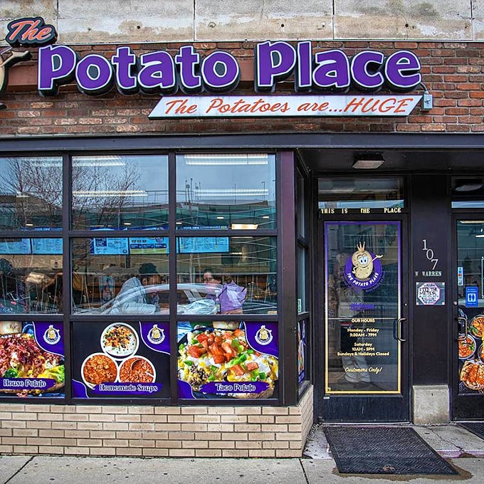 The exterior view shows the restaurant's prominent position on the street, with window displays showcasing their signature loaded potatoes.