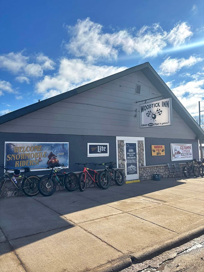 Winter transforms the Woodtick into a snowmobiler's haven, with riders stopping in to warm up before hitting the extensive trail system.