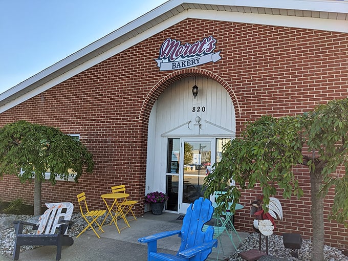 That cheerful patio with its bright blue chairs practically begs you to sit down, relax, and enjoy your treats while pretending calories don't exist outdoors.
