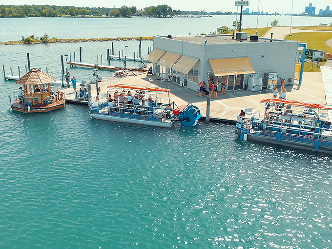 The dock setup reveals the behind-the-scenes staging area where tropical dreams are launched onto Great Lakes waters, one thatched roof at a time.