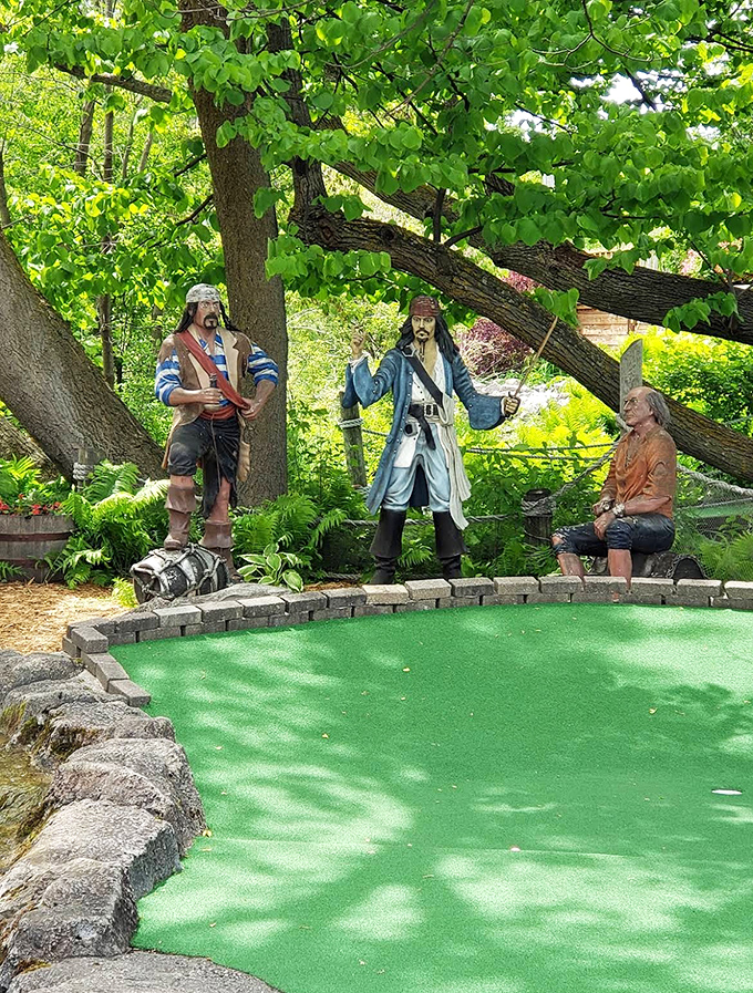 These stoic pirate sentinels have witnessed thousands of terrible putts, yet they maintain their dignified expressions despite the putting carnage below.