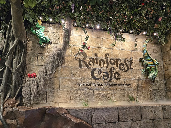 The Rainforest Cafe entrance offers a themed dining experience after your underwater adventure, complete with animatronic wildlife.