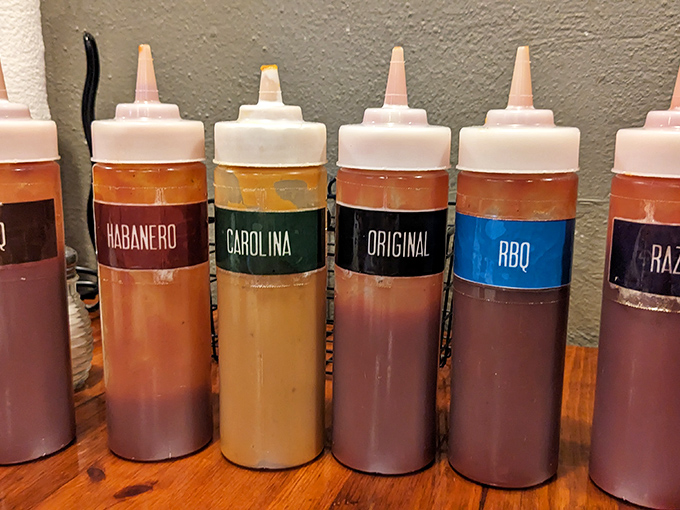 A rainbow of house-made sauces &ndash; from Carolina tang to habanero heat &ndash; lets you customize every bite to perfection.