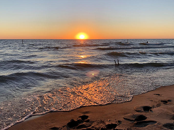 Nature's nightly masterpiece &ndash; when Lake Michigan mirrors the sky's fiery farewell to another perfect day.