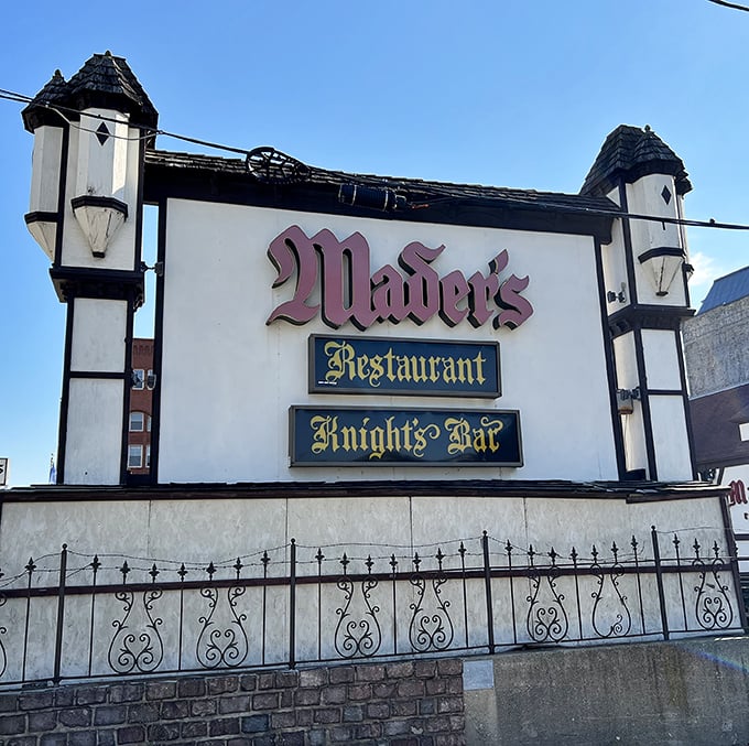 Signage: The iconic Mader's sign announces this Milwaukee landmark, where Knights Bar and Restaurant promise German hospitality behind that distinctive facade.