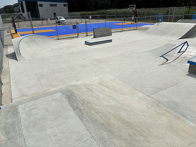 The community skatepark provides concrete waves for landlocked surfers – where wipeouts earn respect and everyone's learning something new.