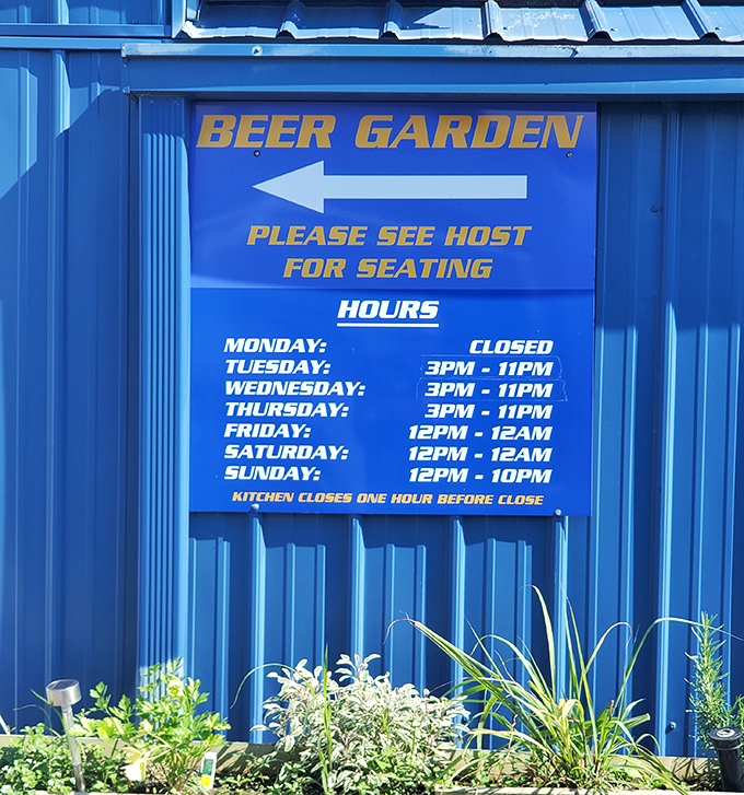 The blue sign tells a simple truth &ndash; some of life's best moments happen between 3PM and midnight at this riverside retreat.