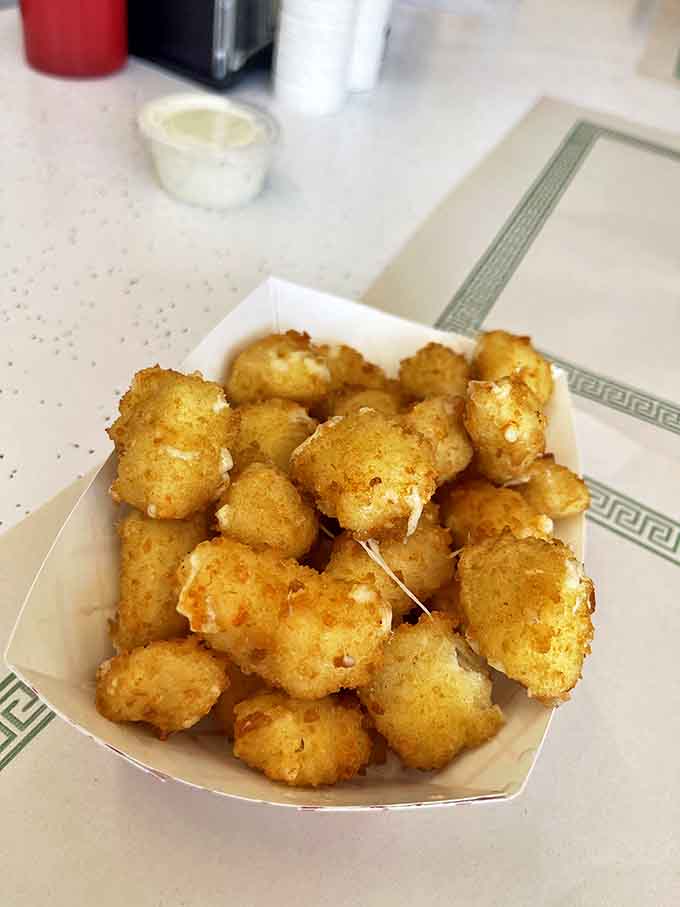 Tater tots: Golden nuggets of potato perfection &ndash; crispy outside, fluffy inside, and impossible to stop eating until the last one disappears.