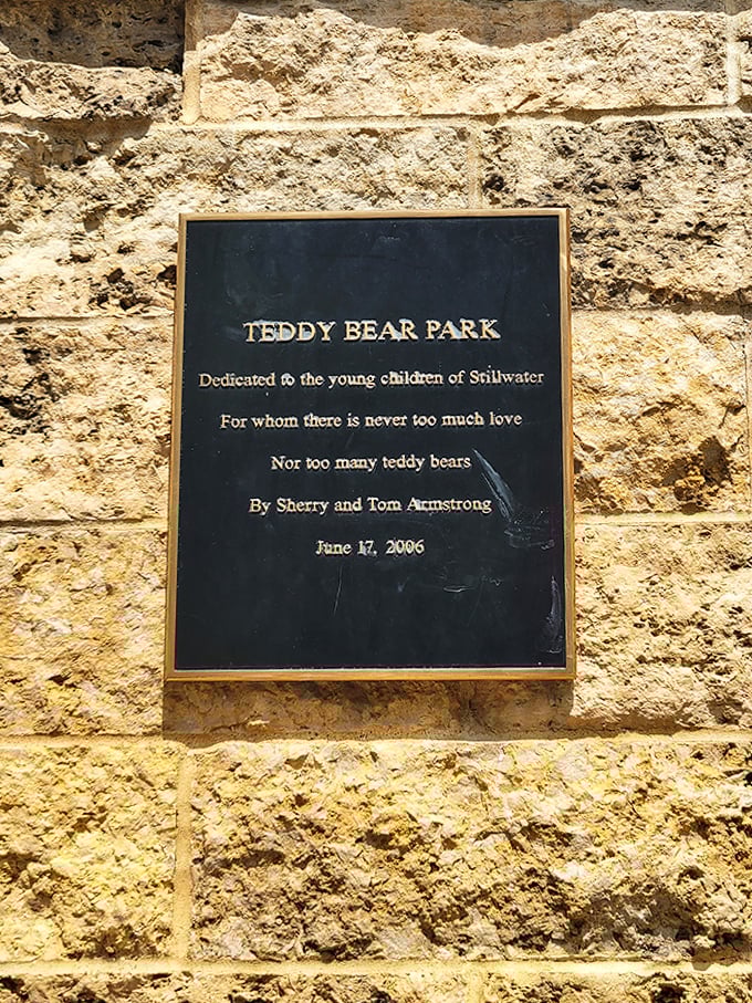 The park's dedication plaque speaks a universal truth: there can never be too much love nor too many teddy bears.