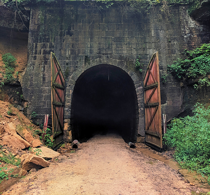 Massive stone archways frame the tunnel entrances, showcasing the incredible craftsmanship that went into creating these engineering marvels.