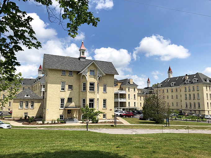 The Village at Grand Traverse Commons transforms a historic asylum into a modern gathering place where Victorian architecture meets contemporary cuisine and shopping.