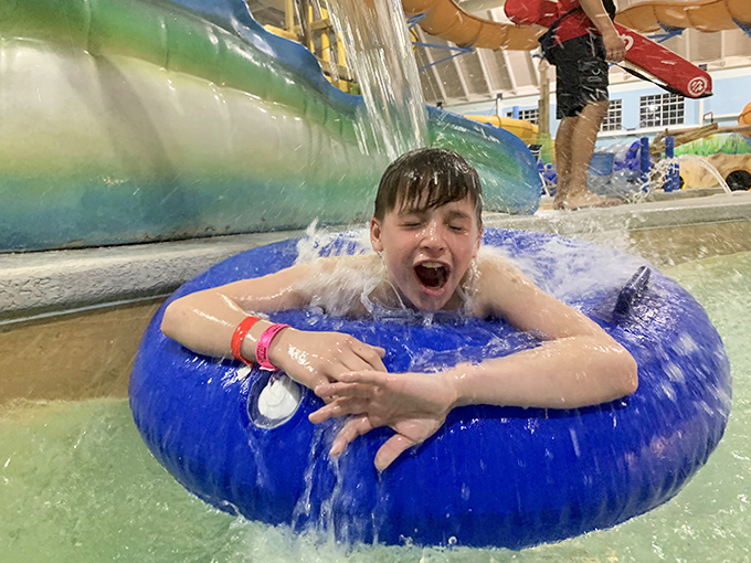 Pure, unfiltered joy radiates from this young tube rider &ndash; the universal expression that says "Again! Let's do it again!"