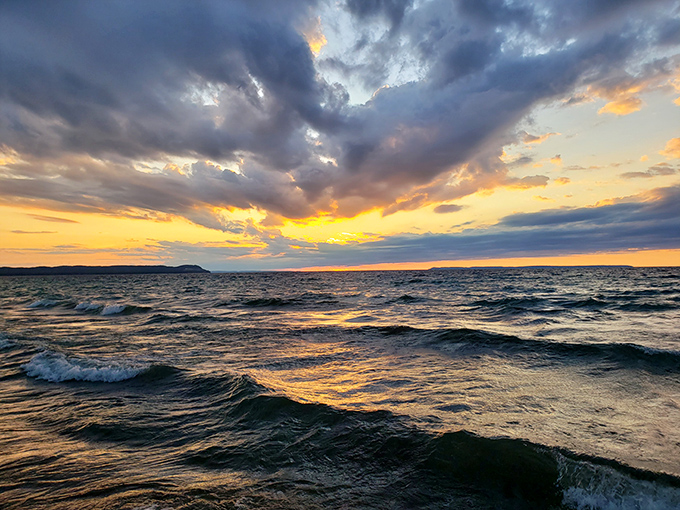 Sunset transforms Good Harbor's waters into liquid gold, proving that Michigan sunsets rival any tropical paradise on earth.