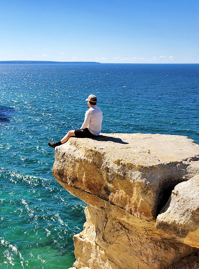 Living on the edge takes on new meaning at Pictured Rocks, where this brave soul finds the perfect spot for contemplation.