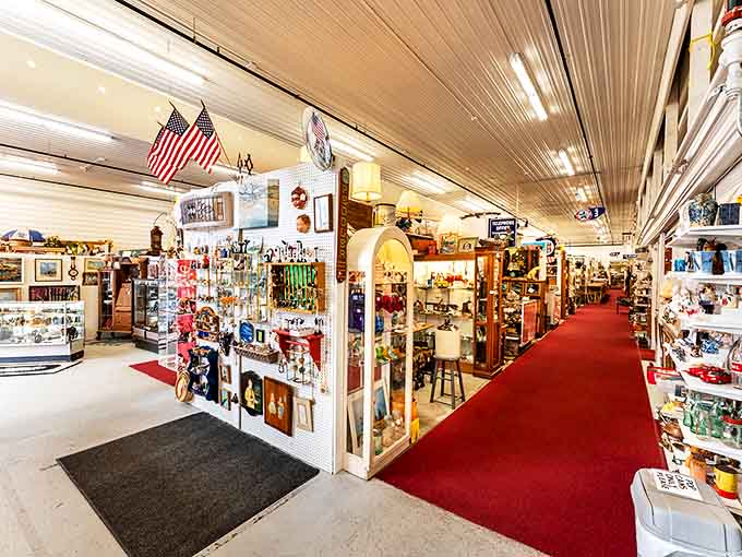 The main aisle stretches before you like a red carpet to the past, each booth a different decade waiting for your visit.